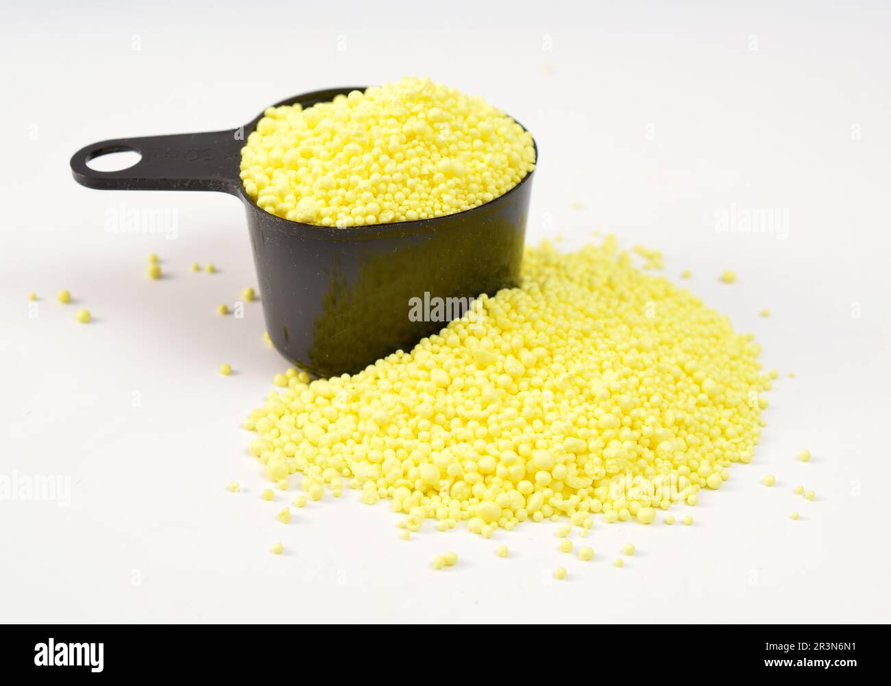 Granulated Sulfur or sulphur on white background Stock Photo - Alamy