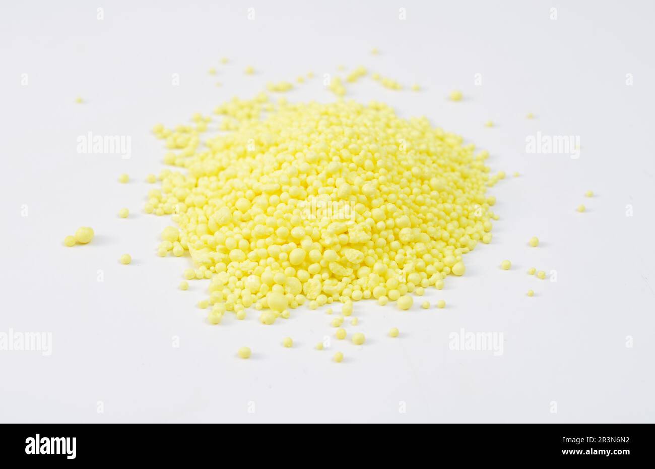 Granulated Sulfur or sulphur on white background Stock Photo - Alamy
