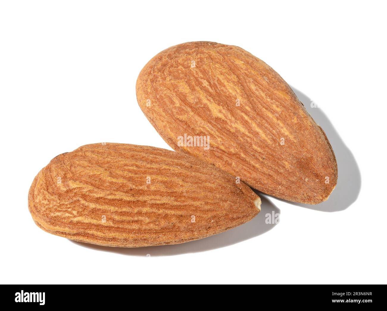 Almond kernel on a white isolated background Stock Photo - Alamy