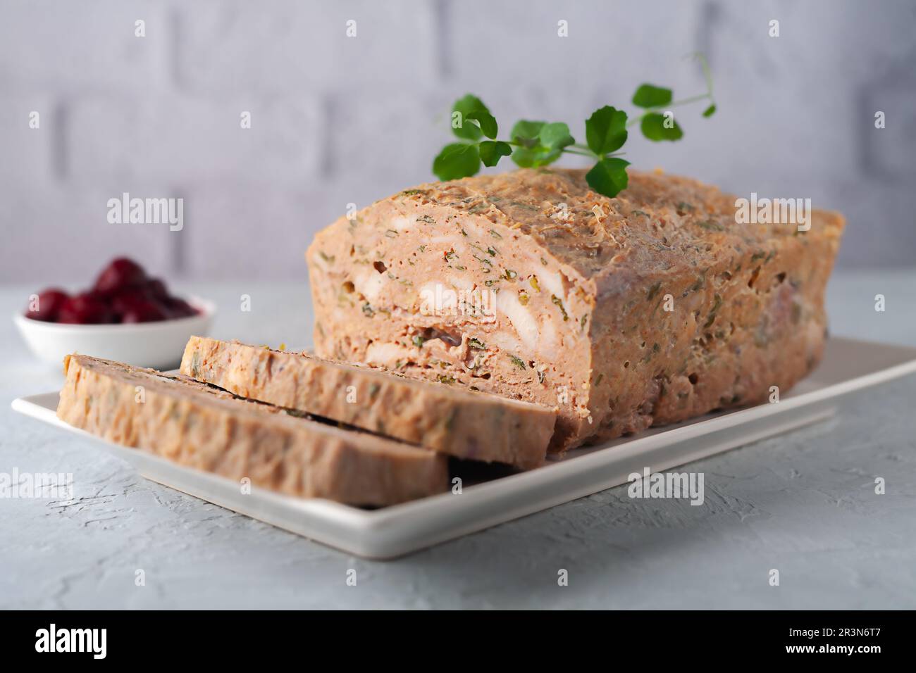 Chicken terrine. Chicken meat pate with fresh parsley Stock Photo - Alamy