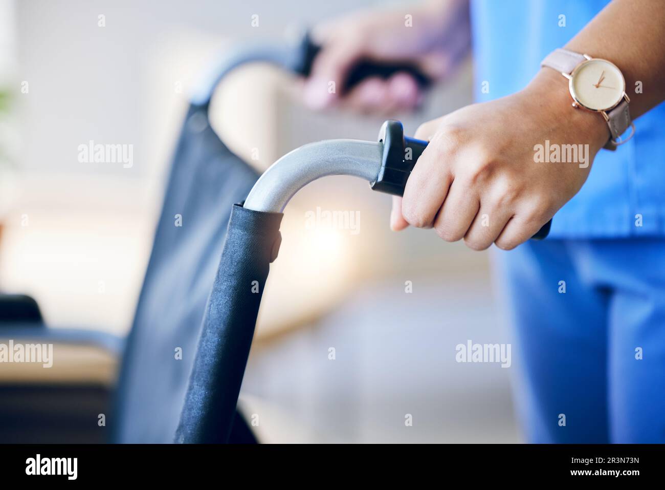 Woman, hands and closeup of wheelchair handles in nursing home for ...