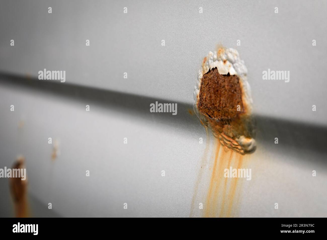 A rust spot on the car. Peeled paint Stock Photo - Alamy