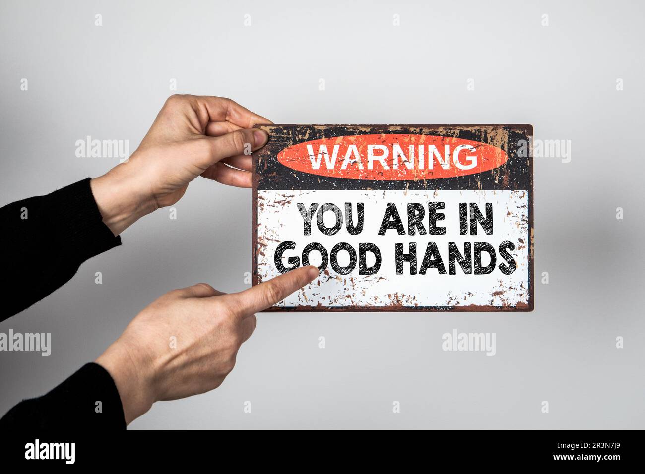 You are in good hands. Warning sign on a white background Stock Photo ...