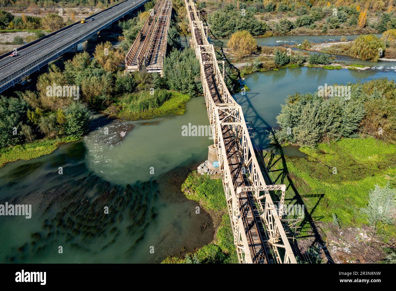 Aerial view of the railroad bridge above a river in Maule region, Chile ...