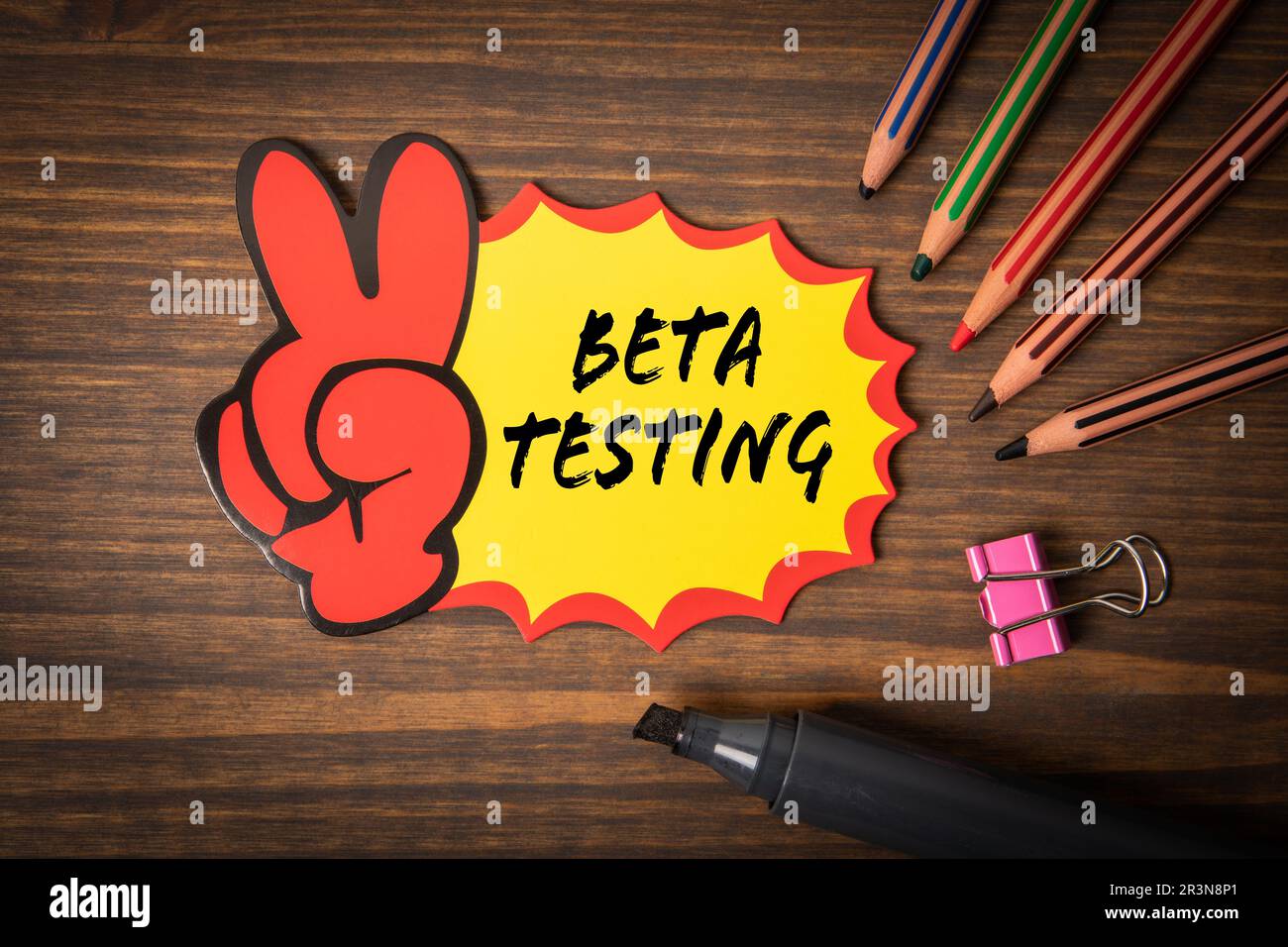 Beta Testing. Sticky note with text on wood texture background Stock ...