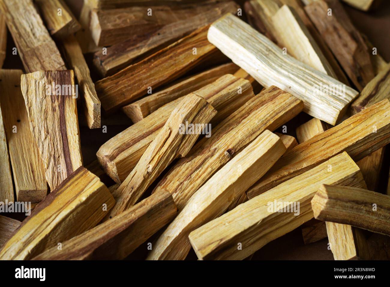 Pile of Palo Santo, holy sacred tree sticks, burning with aroma smoke ...
