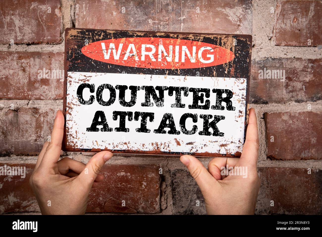Counter Attack. Warning sign with text on red brick background Stock ...