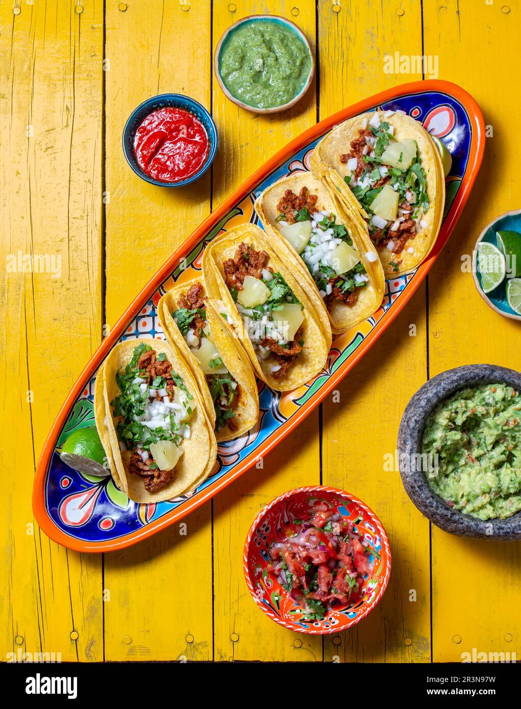 Mexican background with tacos al pastor and mexican sauces. Yellow ...