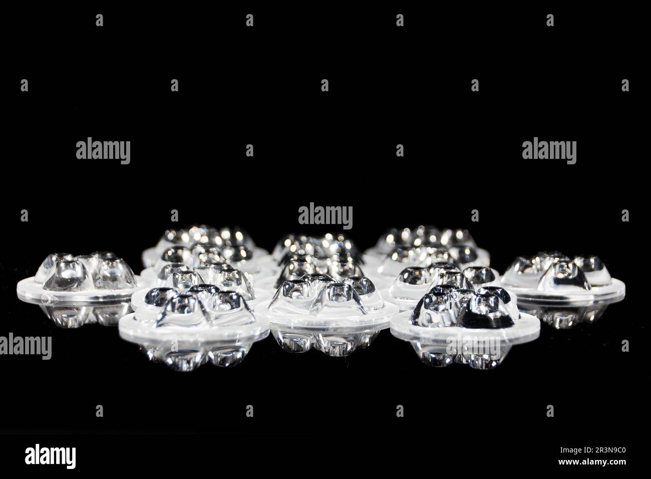 structured black and white real glass objects isolated on black ...