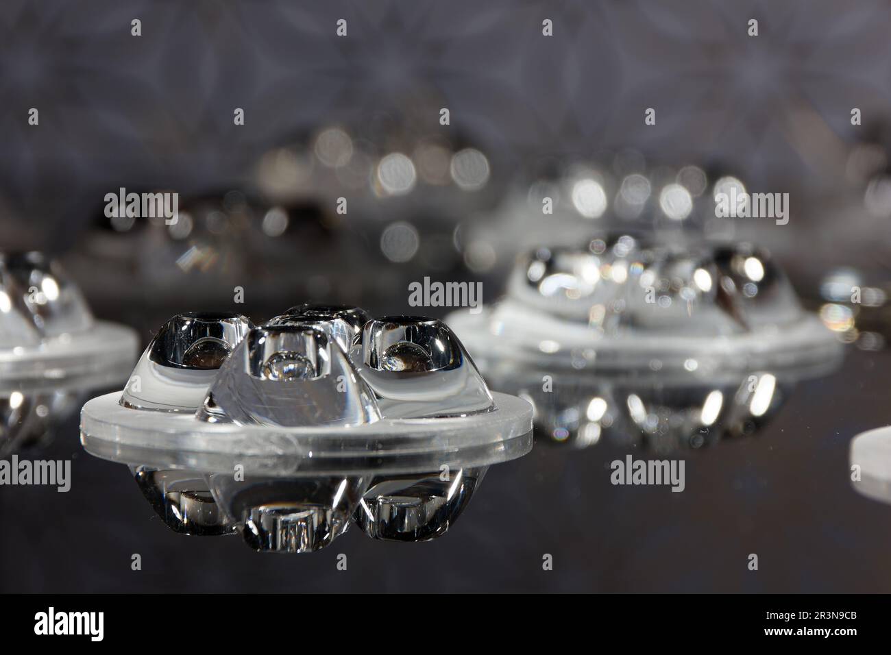 structured black and white real glass objects isolated on black ...