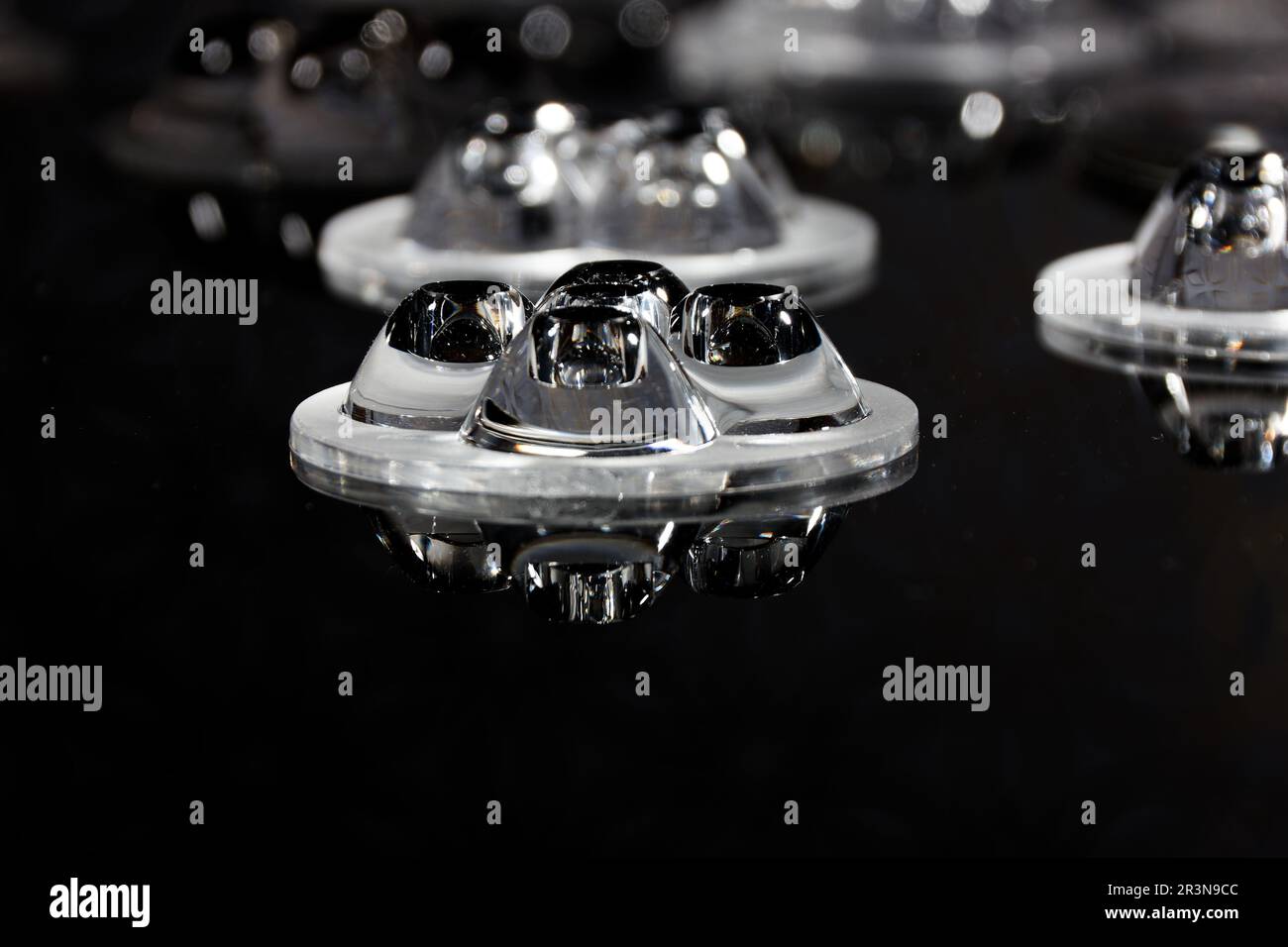 structured black and white real glass objects isolated on black ...