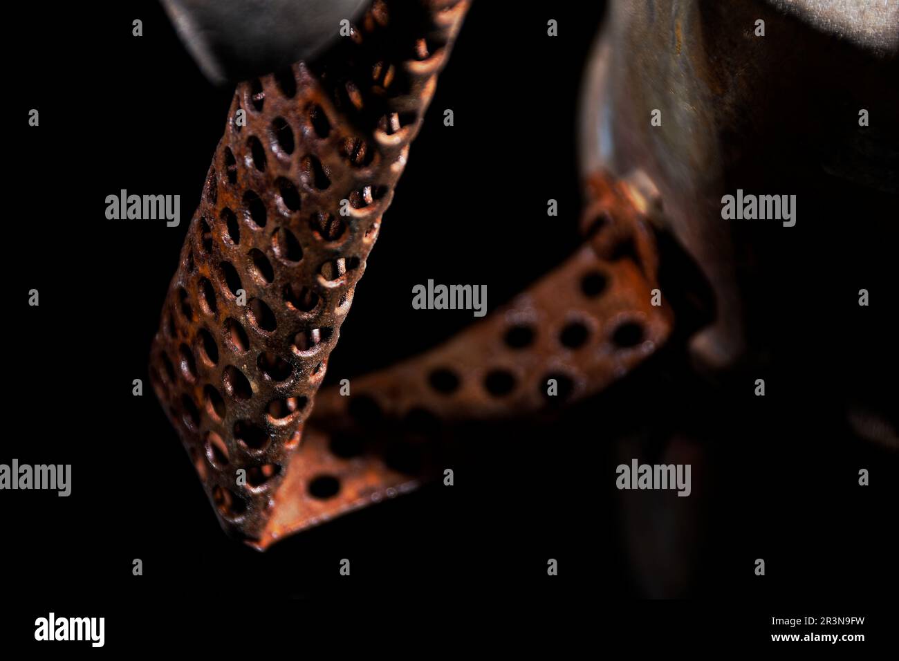 old and vintage blow torch isolated on black background with rust and ...