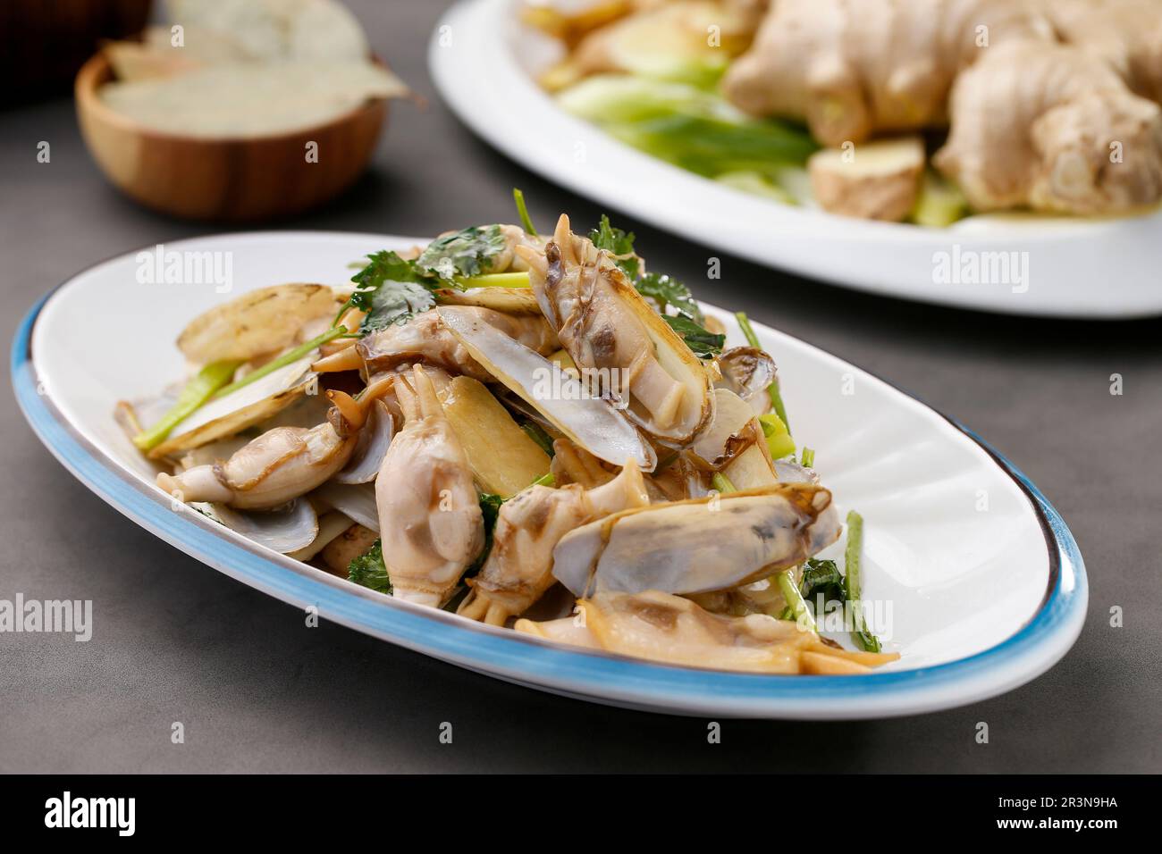 stir-fried razor clam with Ginger and Spring Onions Stock Photo - Alamy