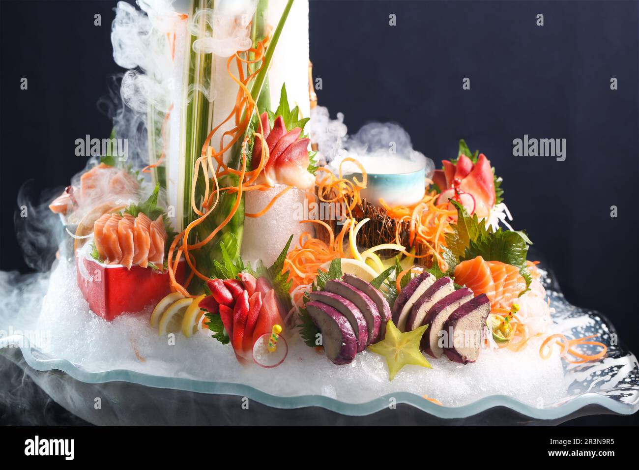 fresh sashimi set on ice。Arctic shellfish, salmon, foie gras with ...