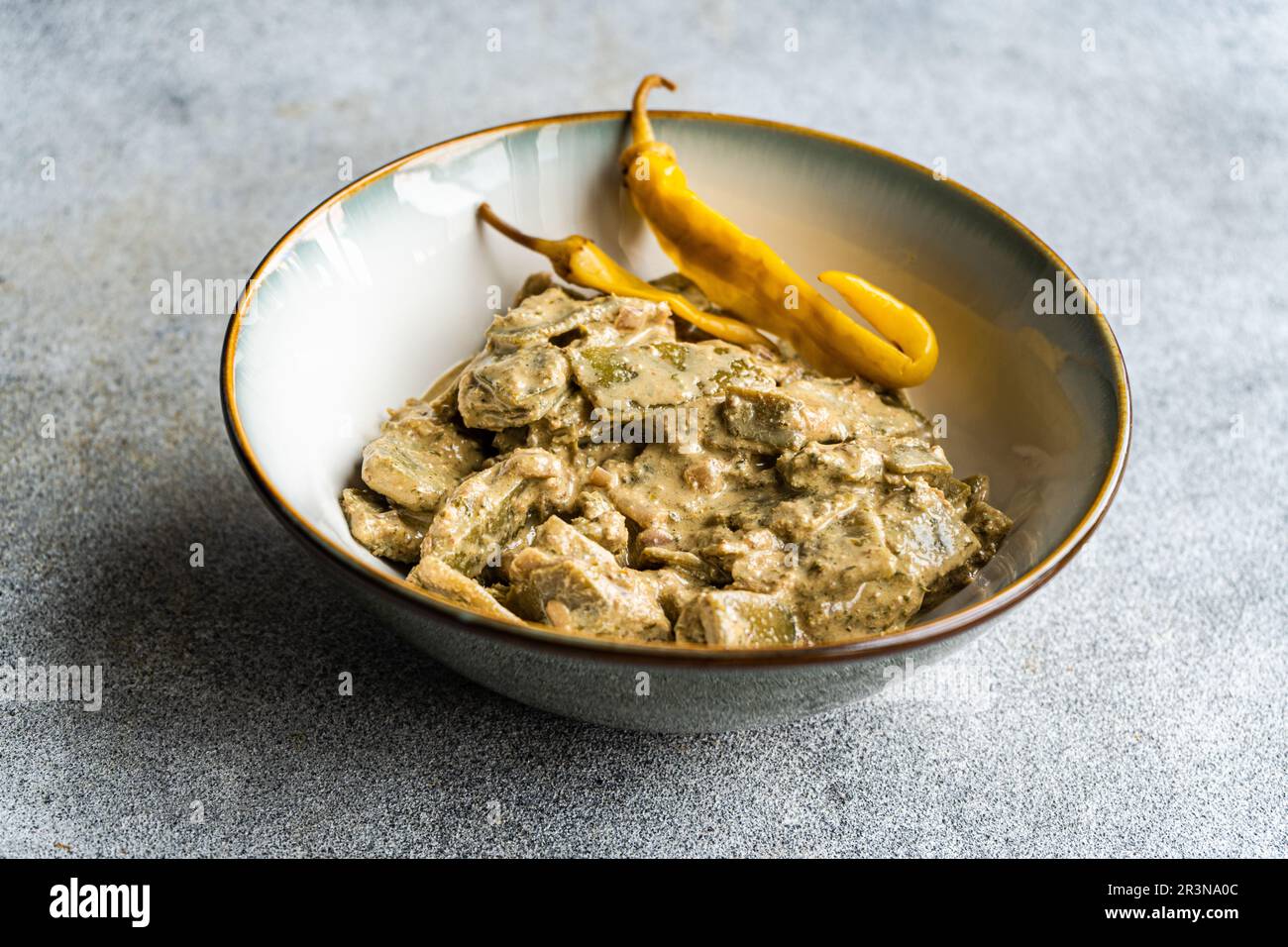 Front view of plate of Georgian green beans with walnut sauce against ...