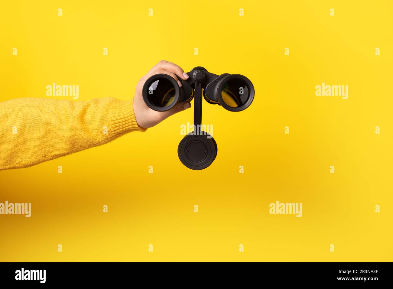 Binoculars in hand Stock Photo - Alamy