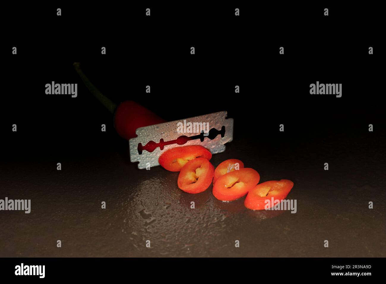 Red chili pepper an razor blade Stock Photo - Alamy