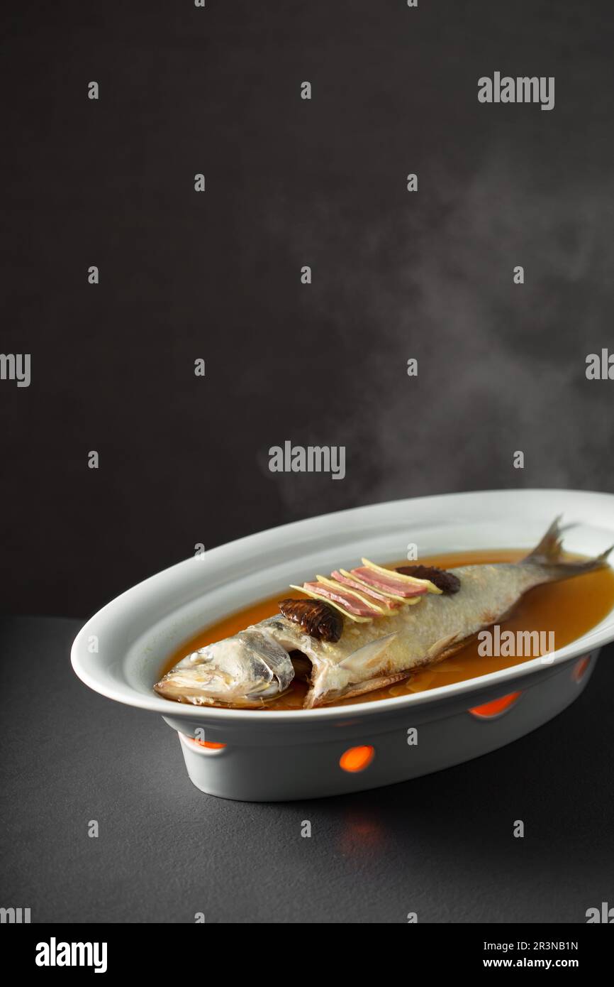 Steamed Topmouth culter fish with ham，Steamed white fish Stock Photo ...