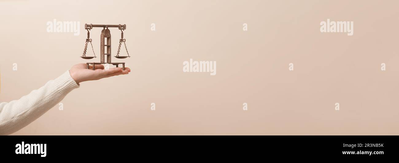 Bronze antique scales on hand Stock Photo - Alamy