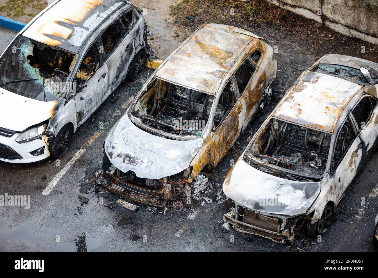 Broken cars after burnt Stock Photo - Alamy