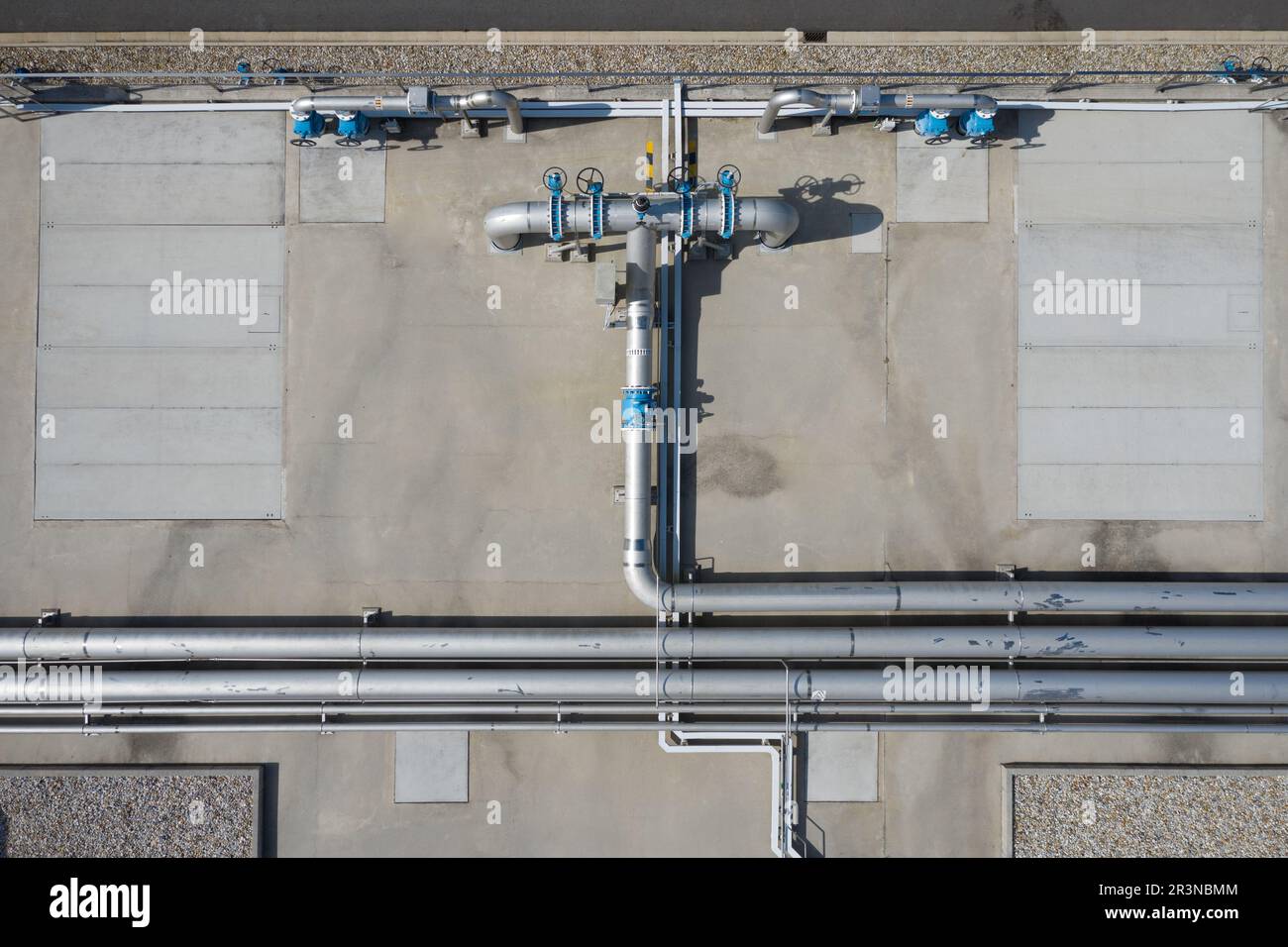 From above of steel water piping structure with circulation pumps and ...