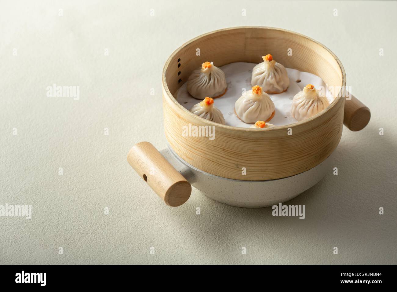 Crab roe xiao long bao，steamed crab and pork dumpling in bamboo steamer ...