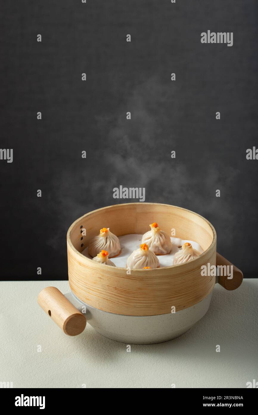 Crab roe xiao long bao，steamed crab and pork dumpling in bamboo steamer ...