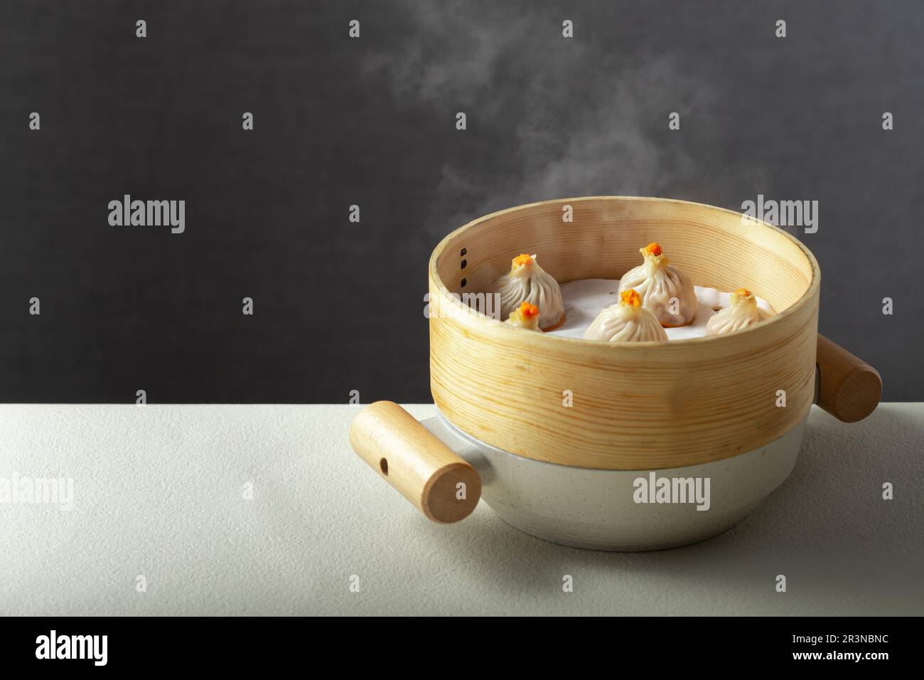 Crab roe xiao long bao，steamed crab and pork dumpling in bamboo steamer ...