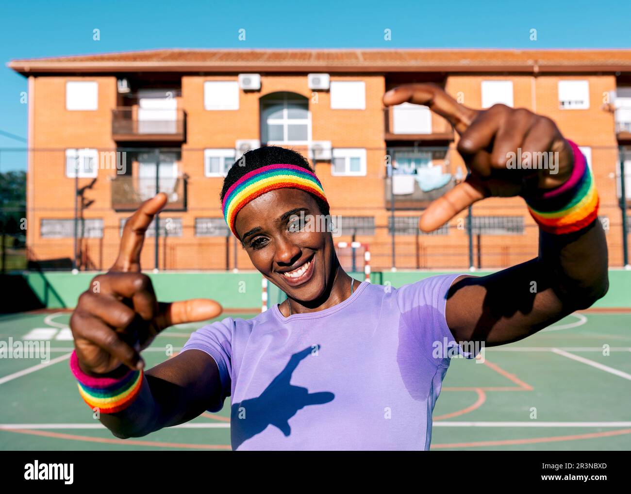 Portrait of cheerful African American female in casual clothes and ...