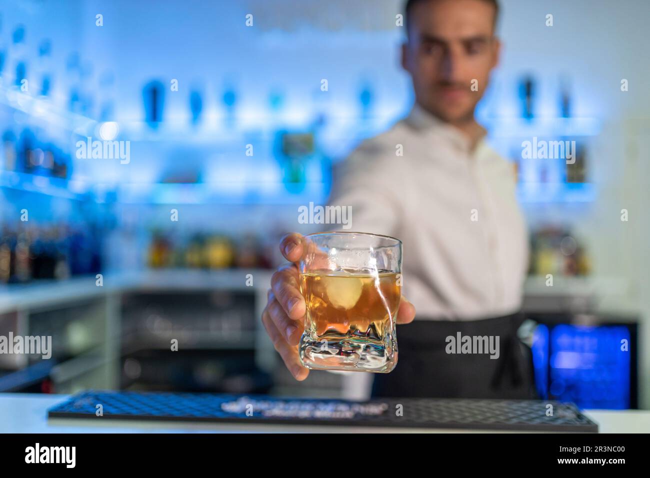 Male staff working behind counter hi-res stock photography and images - Alamy