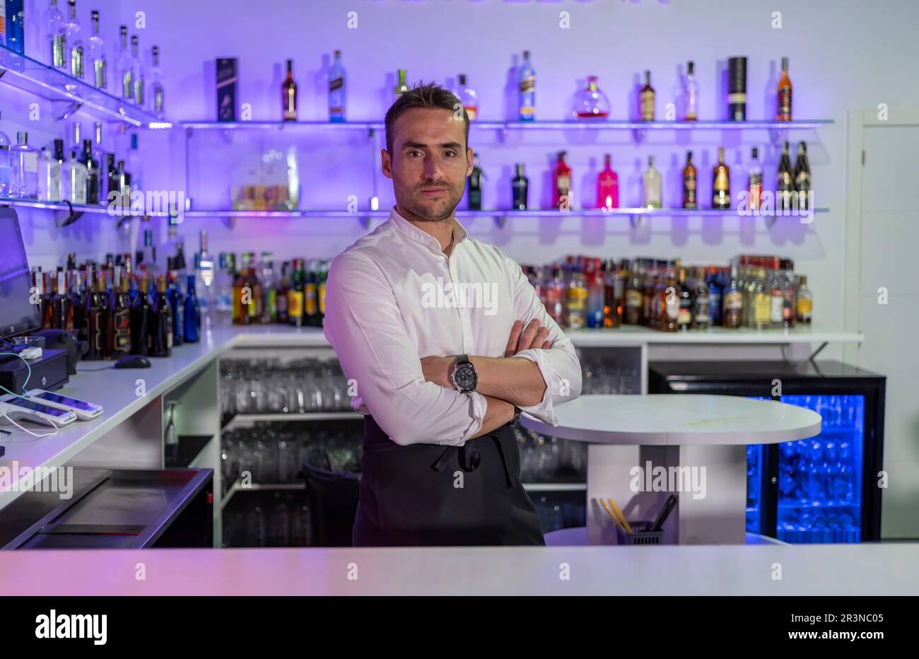 Man standing arms crossed nightclub hi-res stock photography and images ...