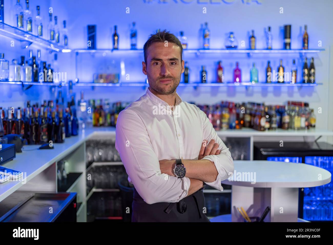 Man standing arms crossed nightclub hi-res stock photography and images ...