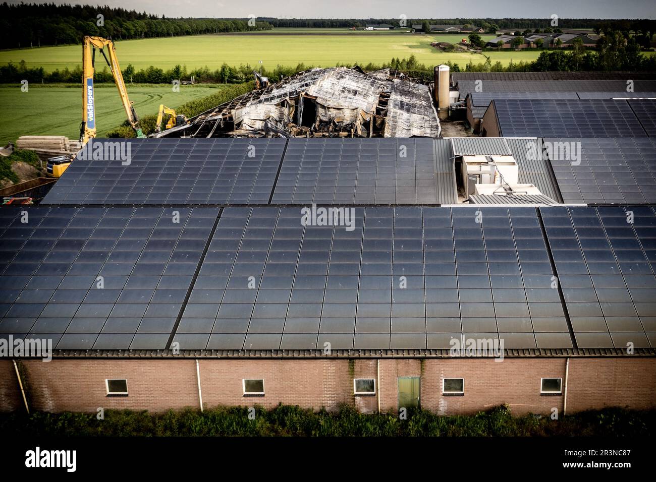 REUSEL - Solar panels on the roof of stables next to a burned down ...