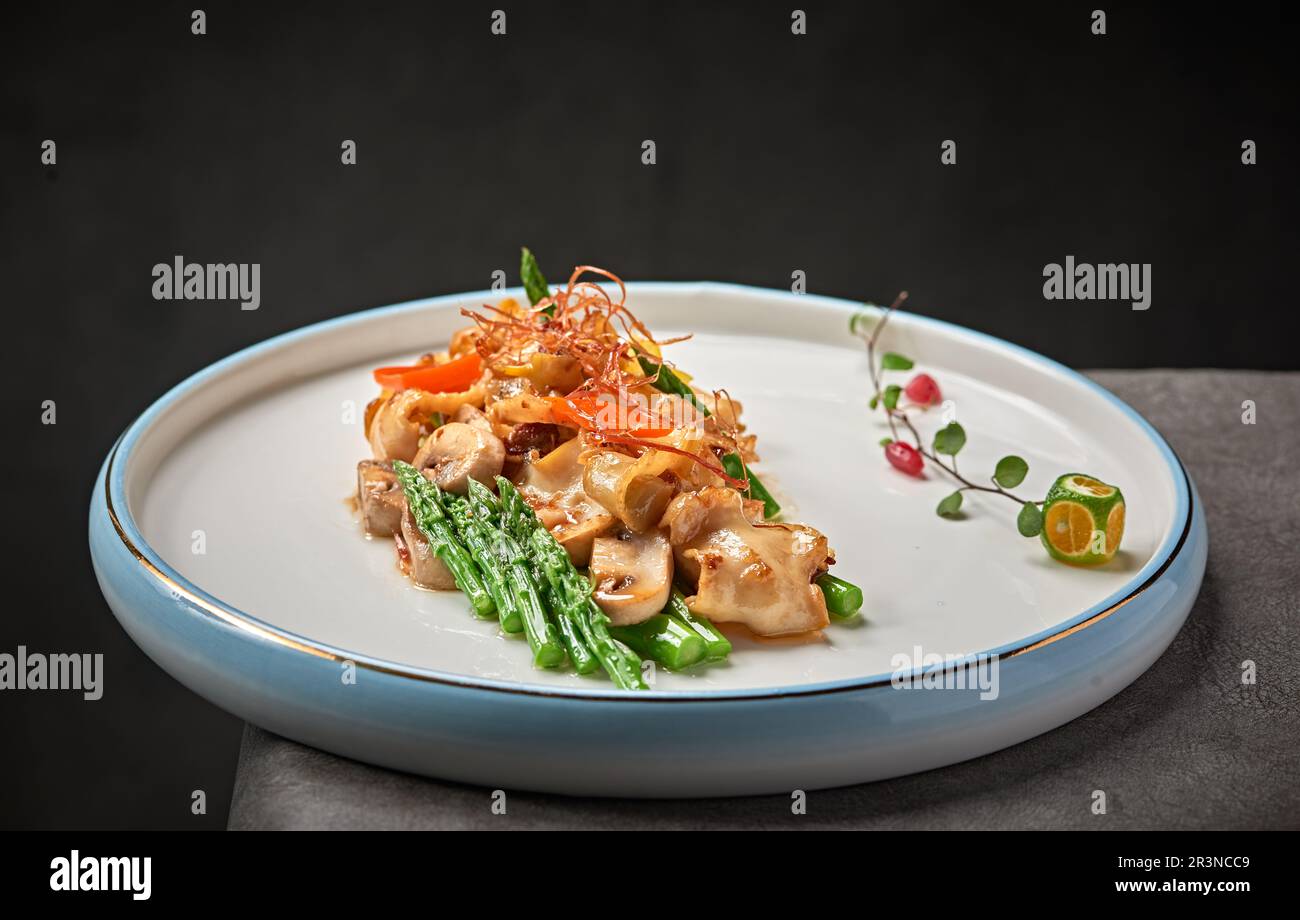 stir-fried slices sea snails or Conch Stock Photo - Alamy