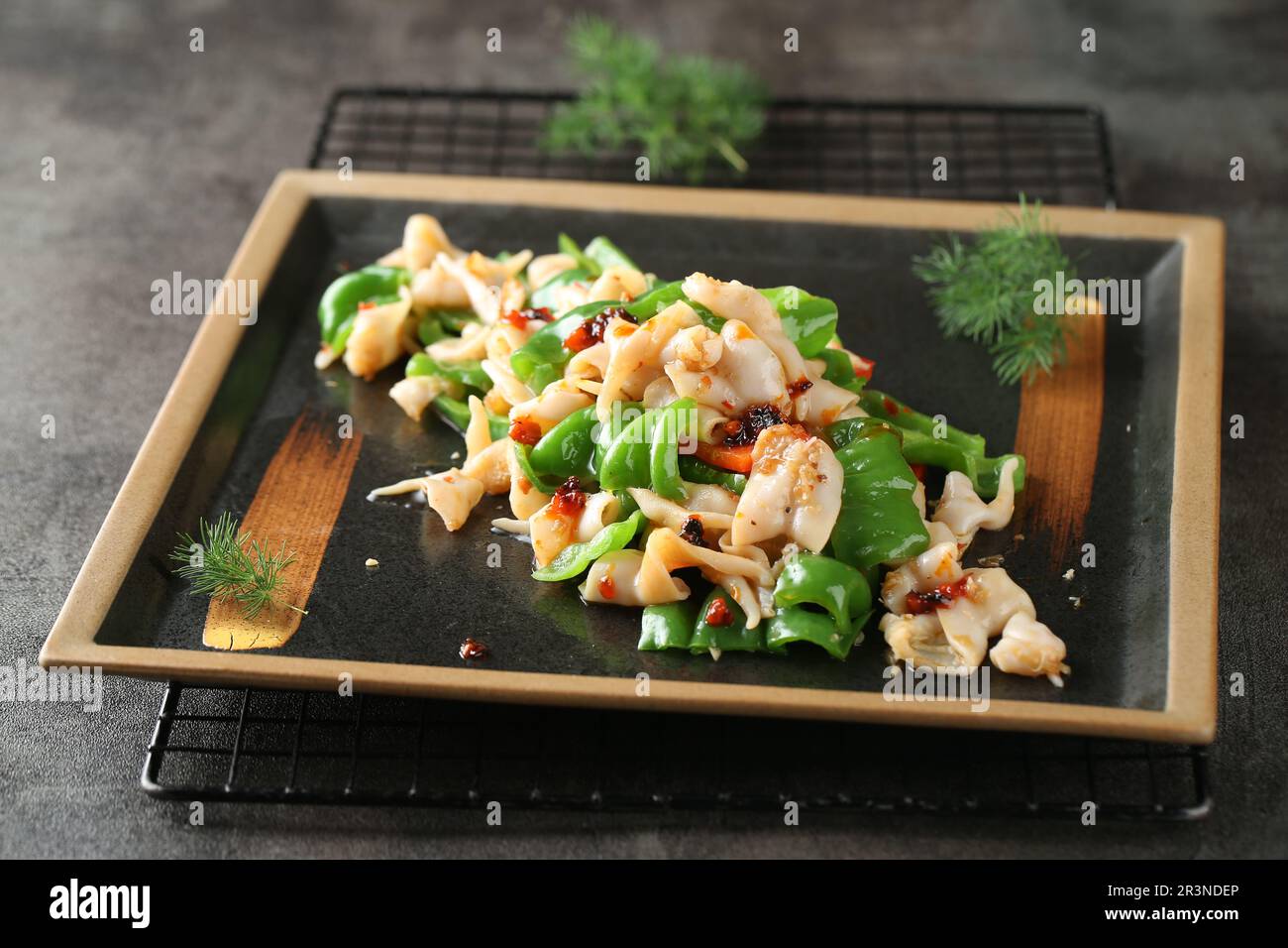 stir-fried slices sea snails or Conch Stock Photo - Alamy