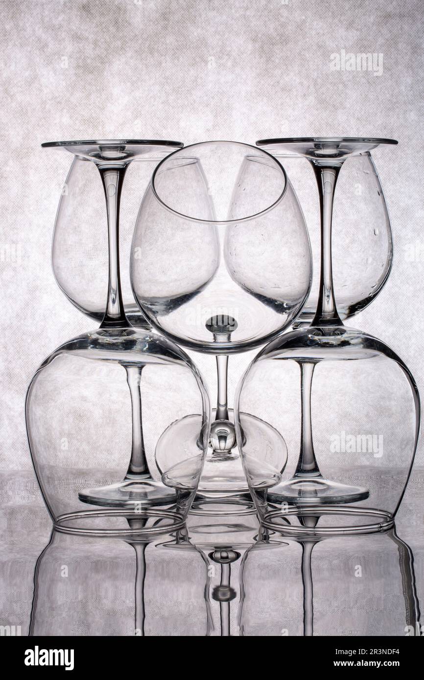 Still life with glass objects on a gray background Stock Photo - Alamy