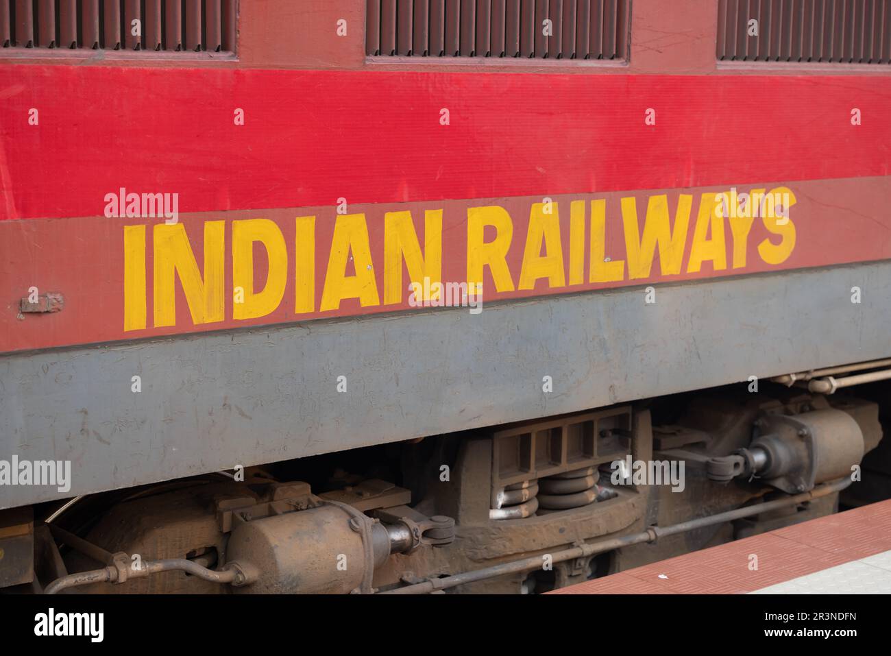 The inscription Indian Railways is displayed on a red Indian train ...