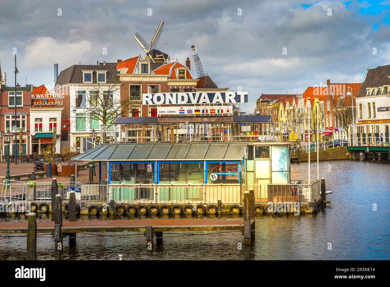 Leiden, Netherlands harbour at canal and windmill Stock Photo - Alamy