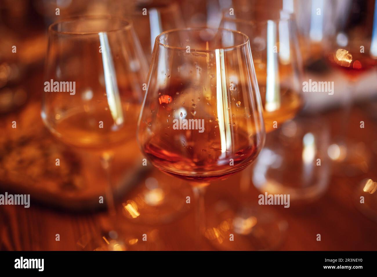 Glass goblets placed in rows on table during wine tasting procedure in ...