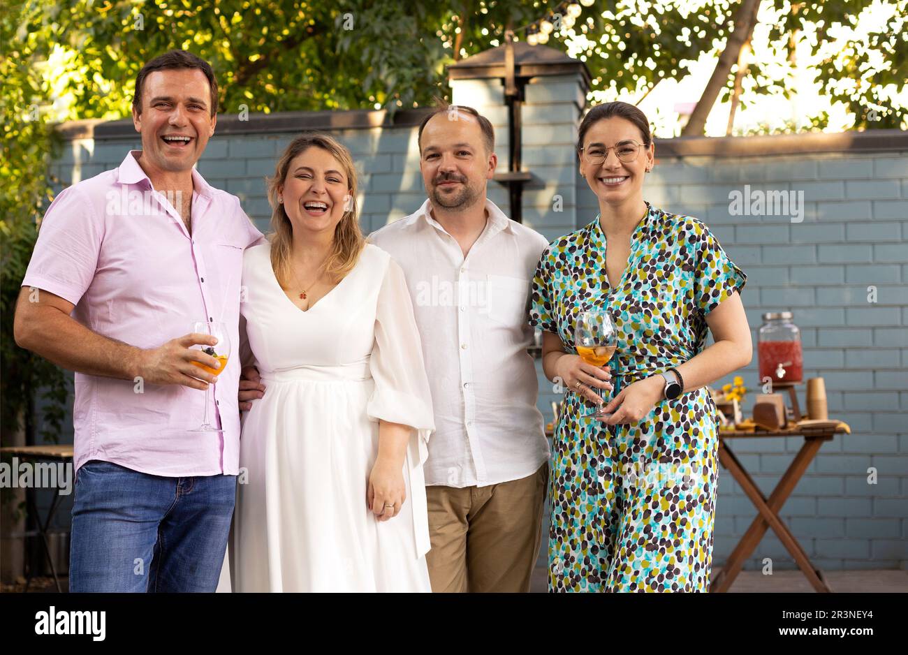 Group of beautiful happy people communicating and smiling while ...