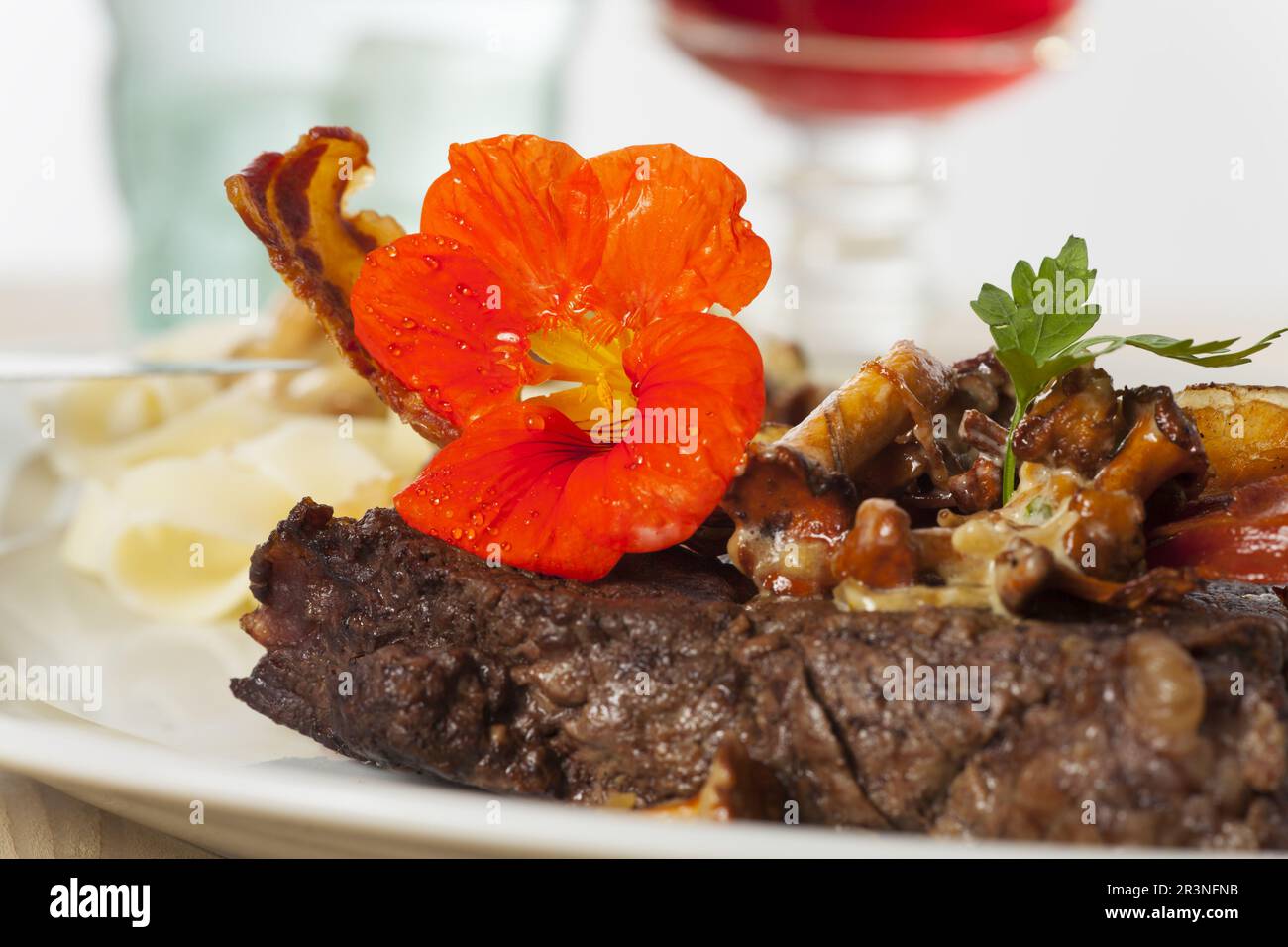 Nasturtium flower on a steak Stock Photo - Alamy