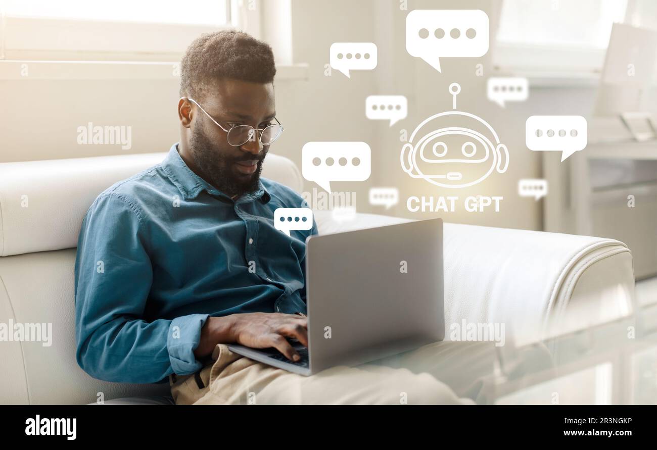 Black man sitting on couch, using laptop with Chat GPT Stock Photo - Alamy