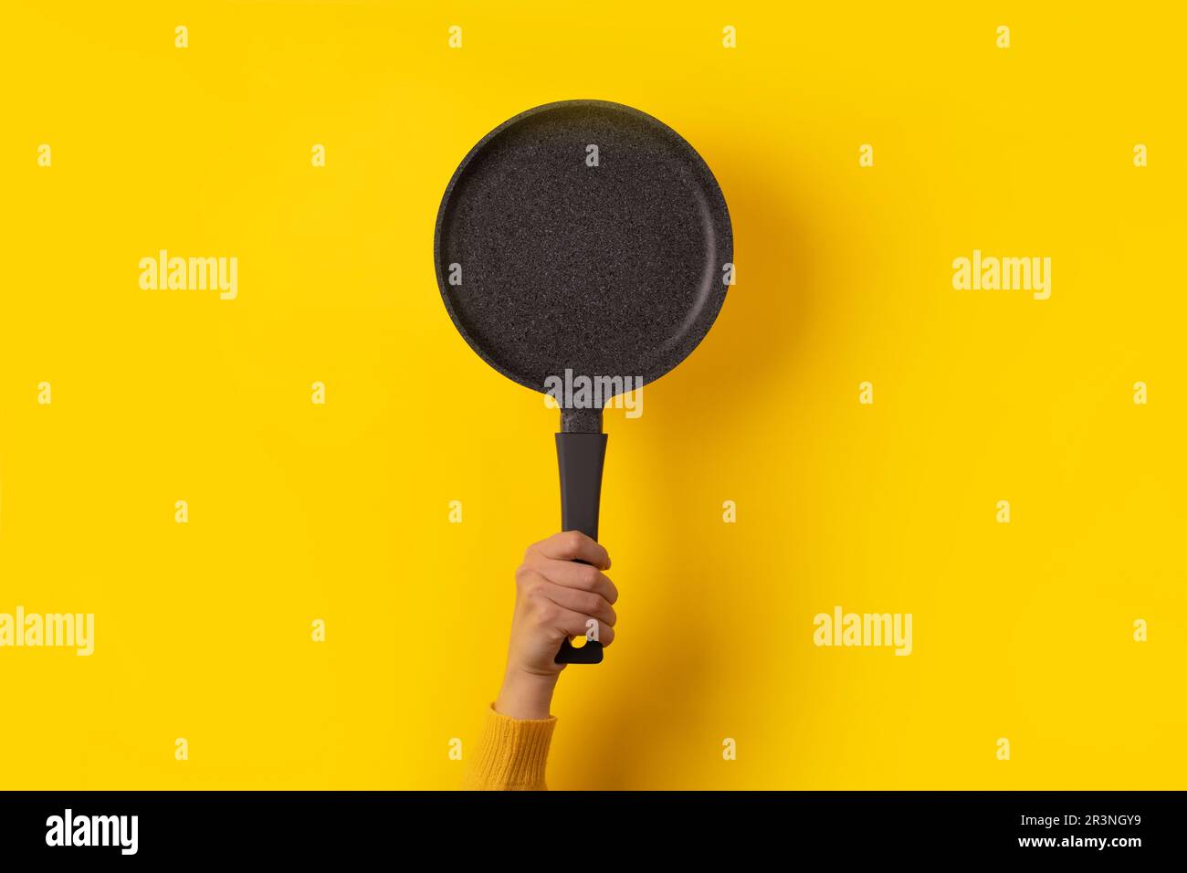 Granite pan in hand Stock Photo - Alamy