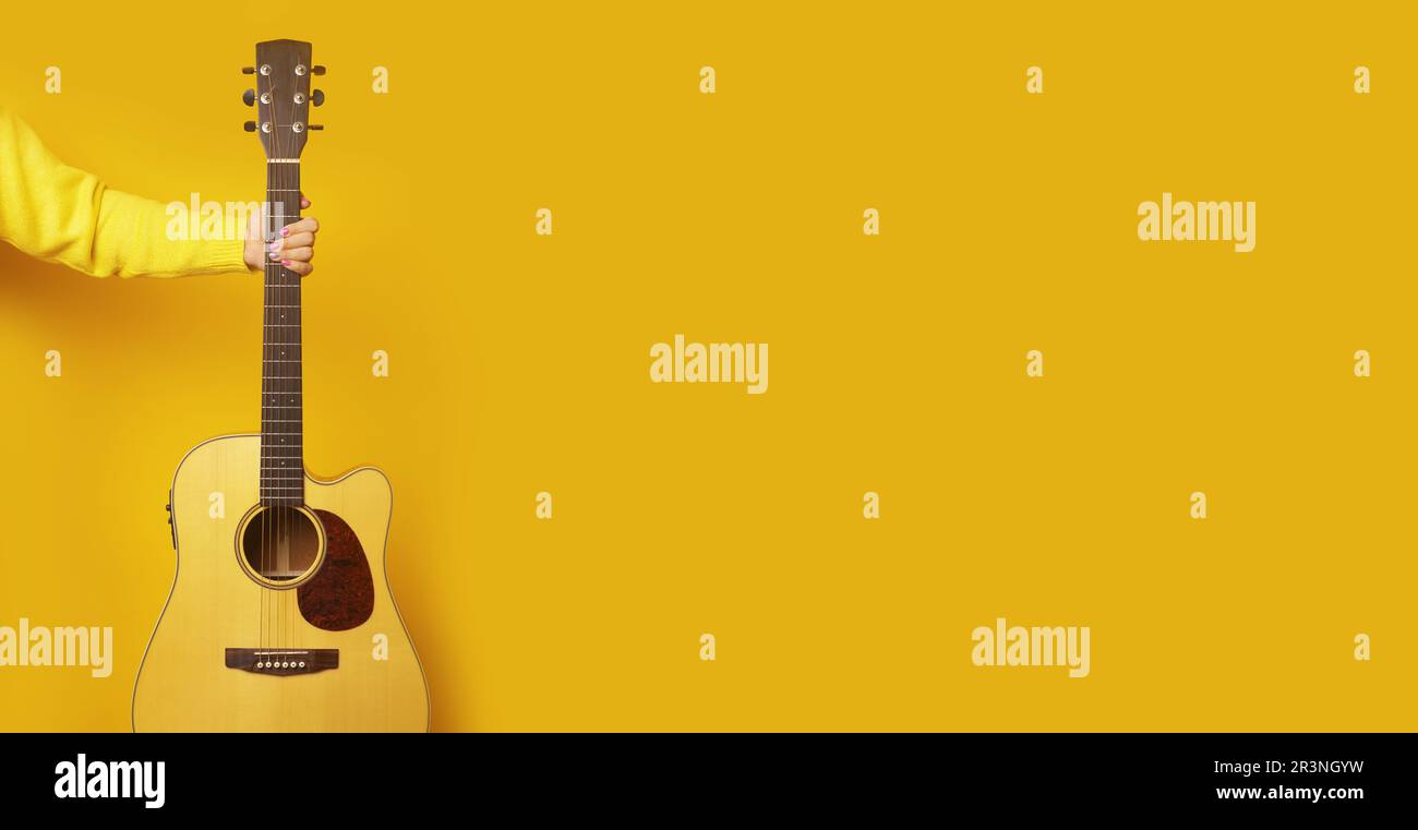 Guitar in hand Stock Photo - Alamy
