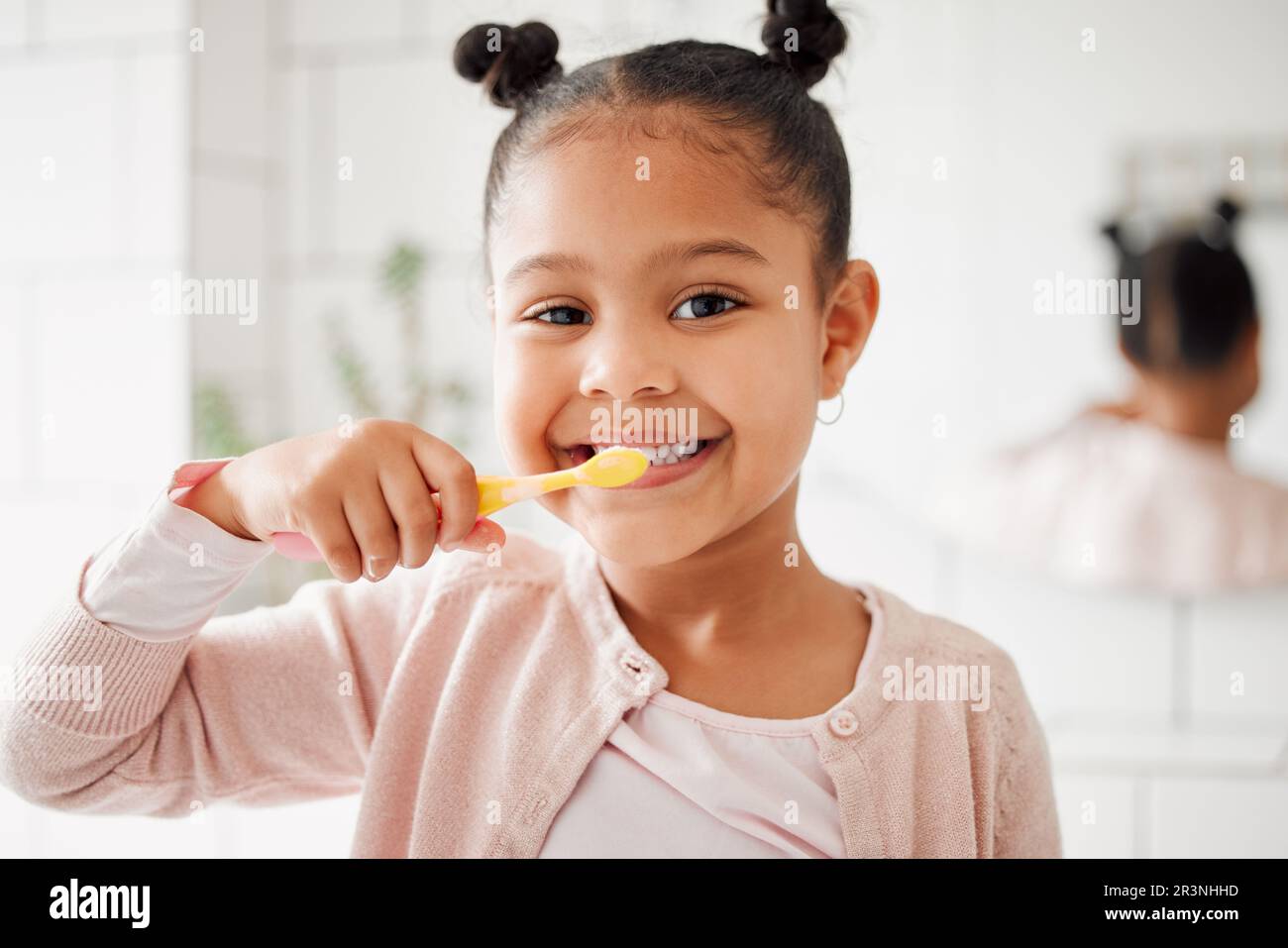 Child, toothbrush and brushing teeth in a home bathroom for dental ...