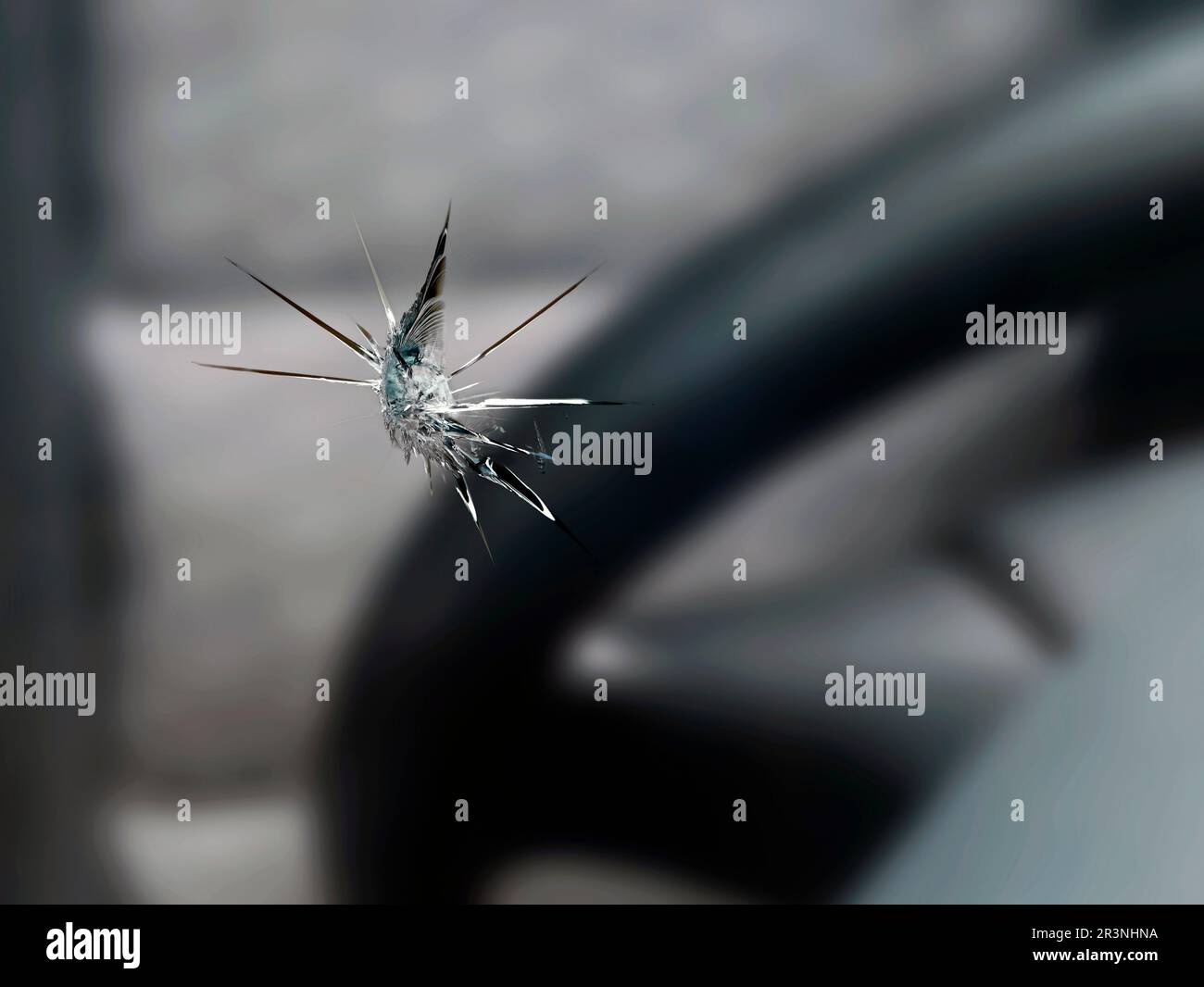close up of a stone chip in the windshield of a car, detail shot of ...