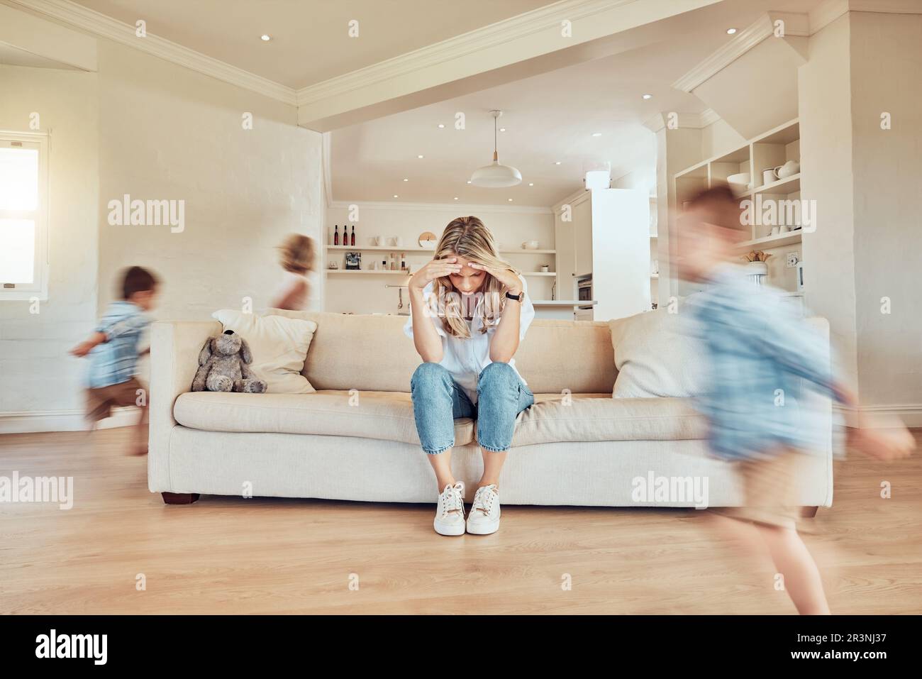 Headache, mother and children running in living room, problem and ...