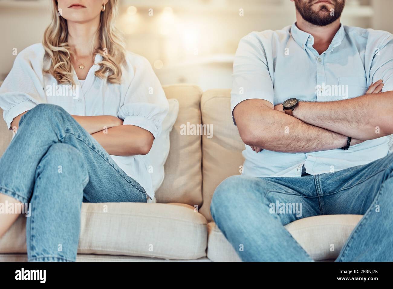 Couple, arms crossed and argument on sofa, home and breakup in divorce ...