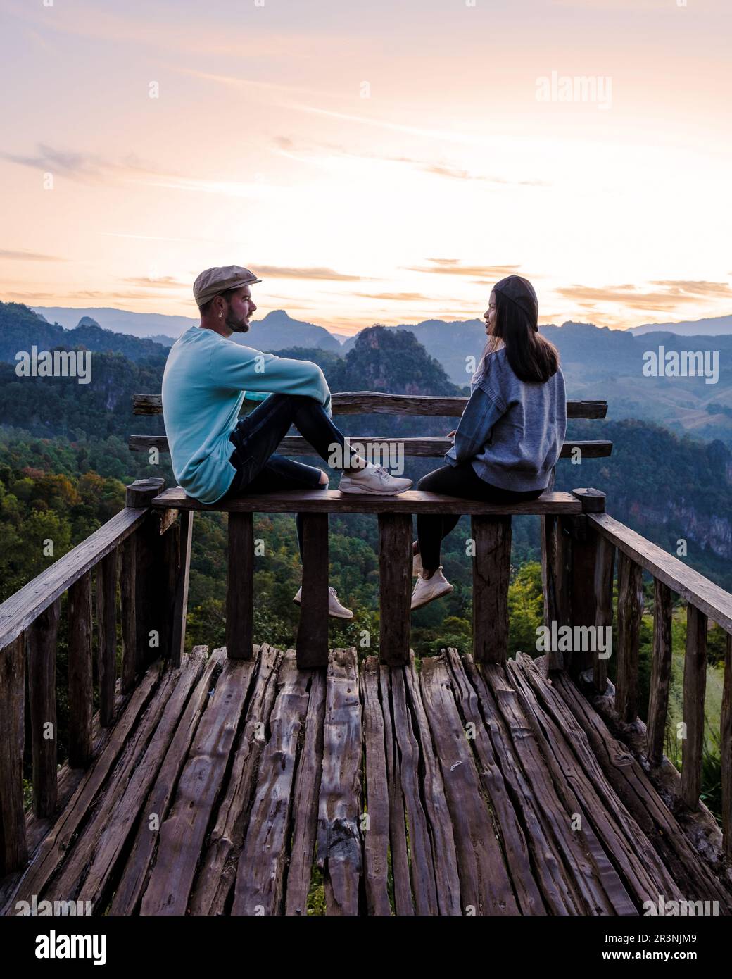 Couple watching the sunrise at Mae Hong Son mountains in Thailand, Ban ...