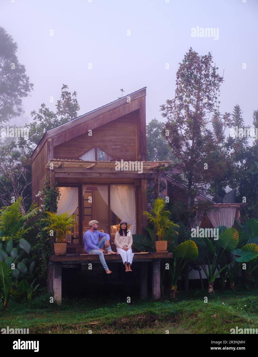 A couple of men and women at a cottage homestay in Northern Thailand ...